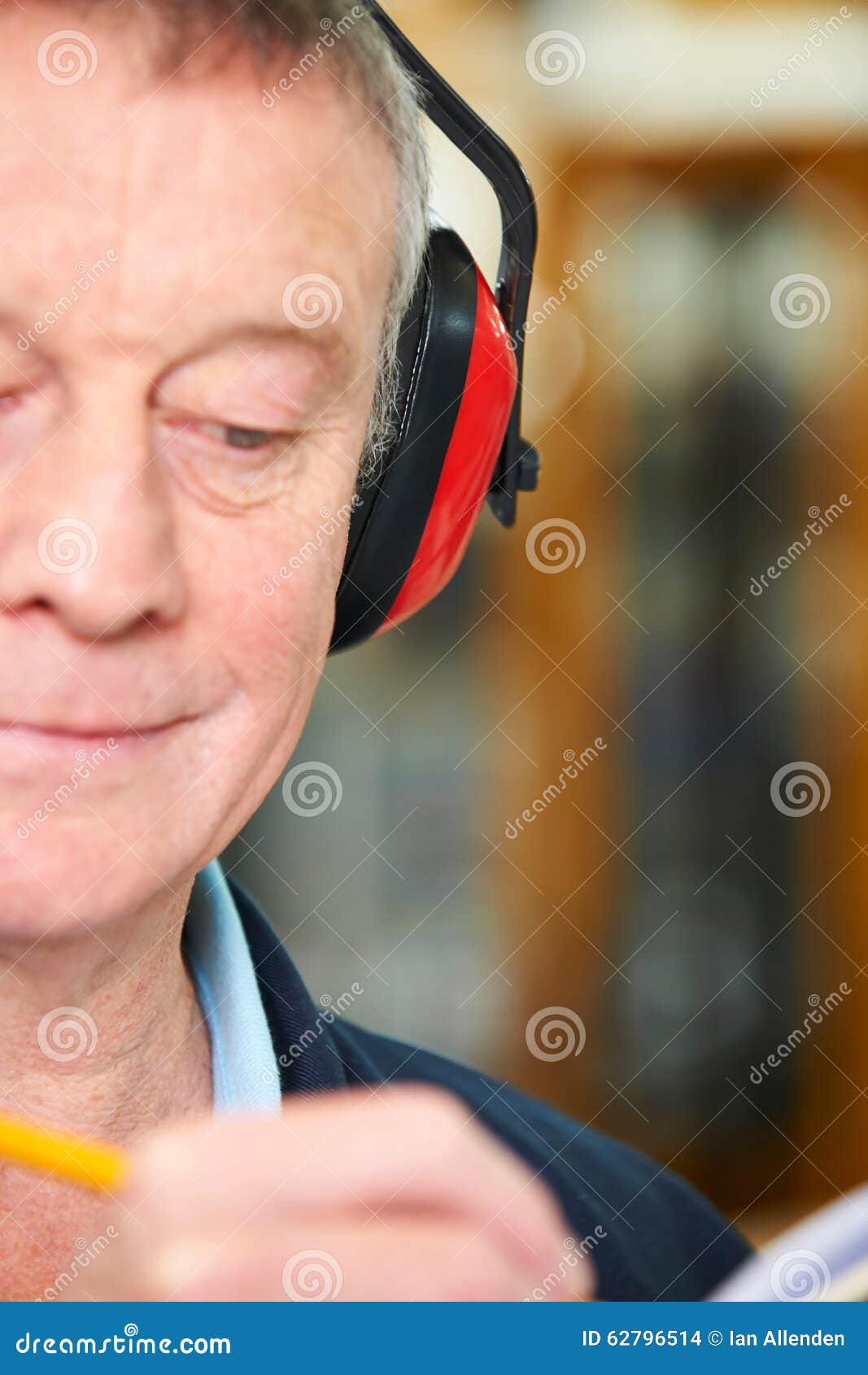 Worker in Factory Wearing Ear Protectors Stock Photo - Image of ...