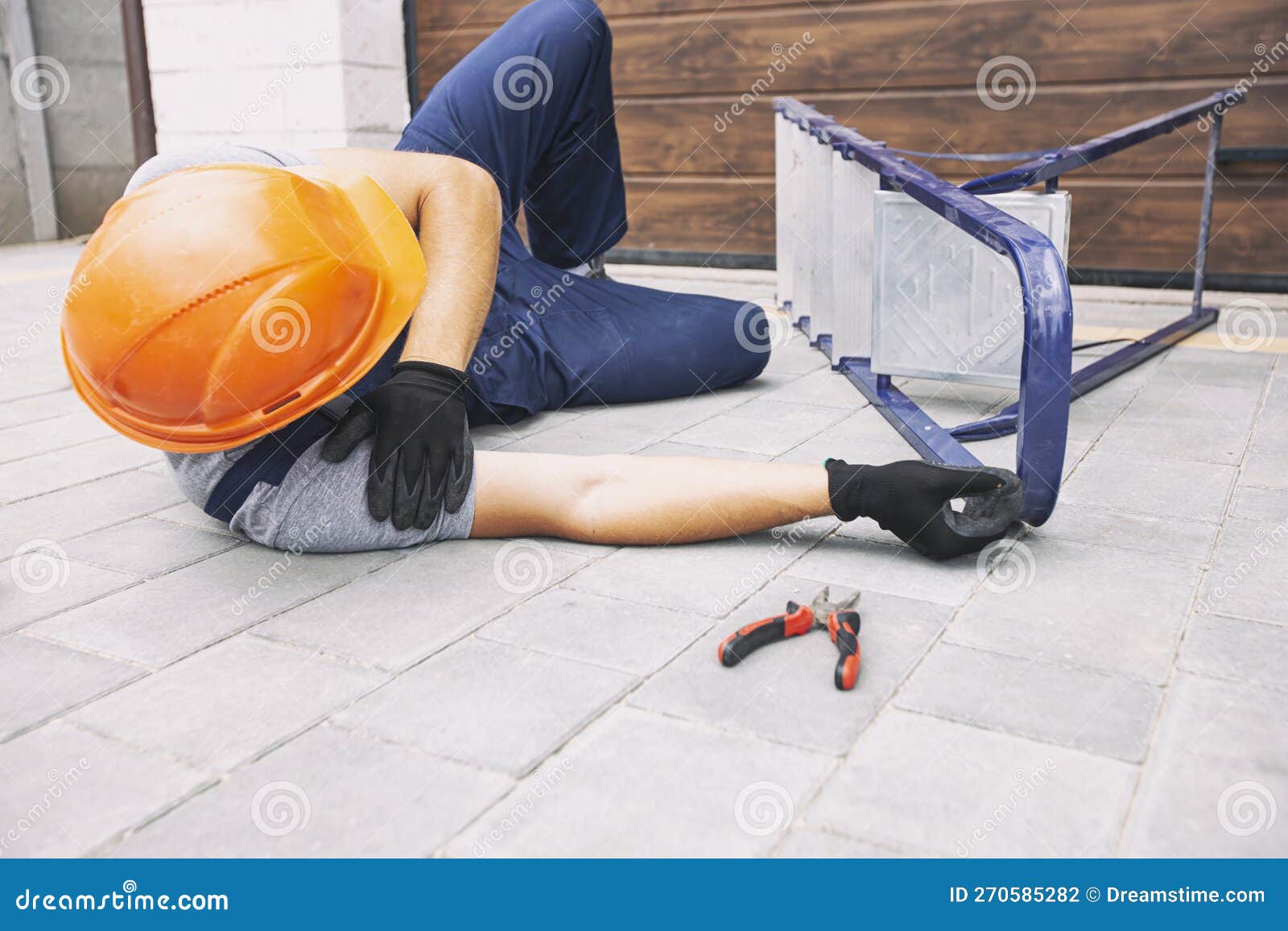 The Worker Fell Down from the Ladder while Working Stock Photo - Image ...