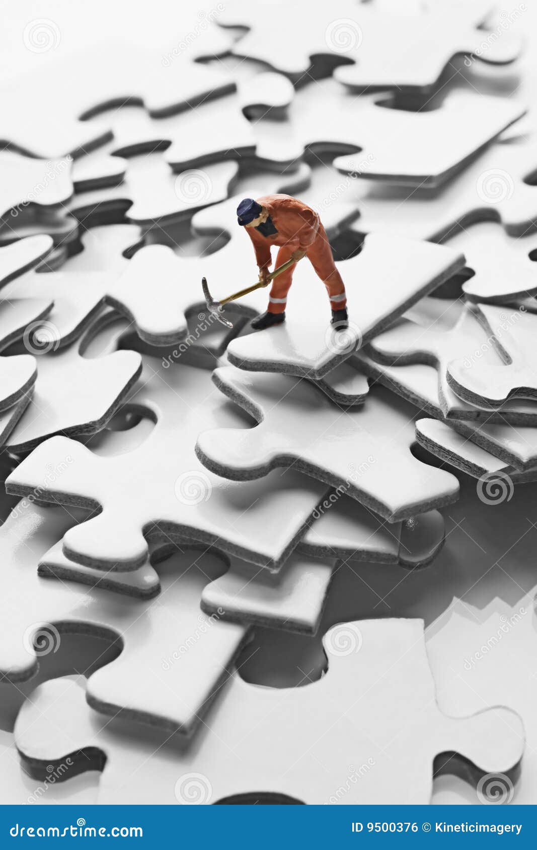 Worker Figurine on Puzzle Pieces Stock Photo - Image of planning ...