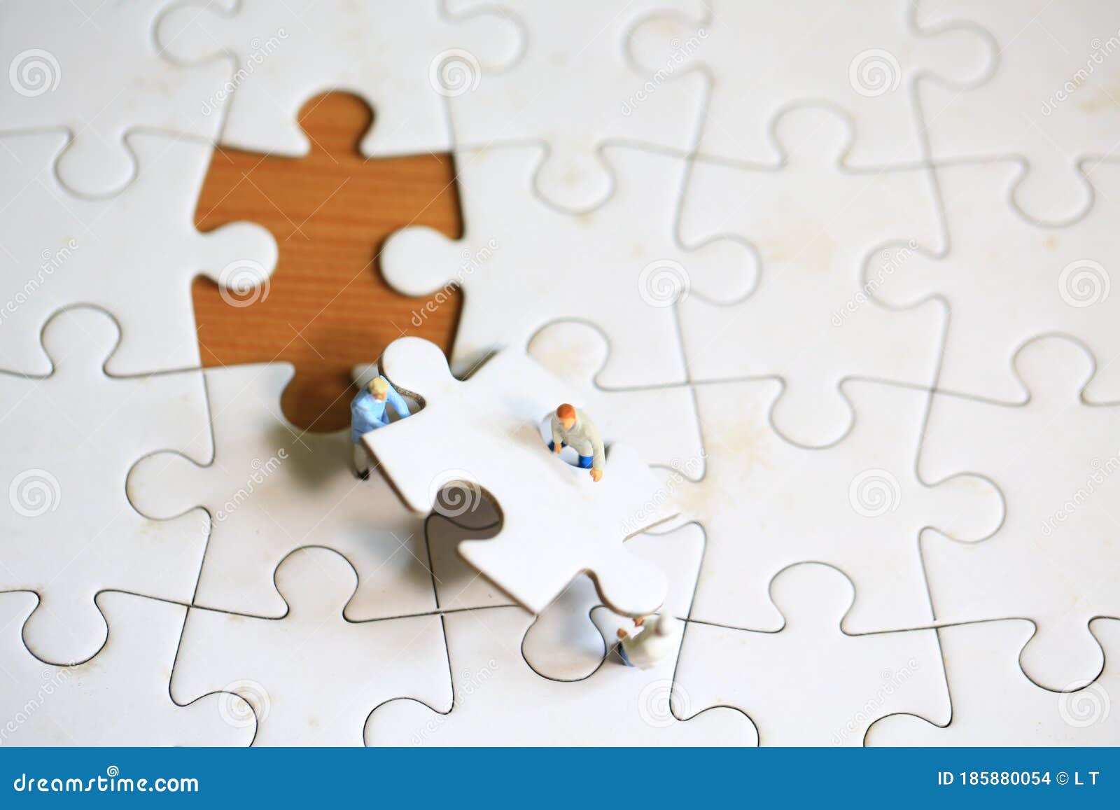 Worker Fix the Puzzle on the Table, Together Work Hard To Solve the ...