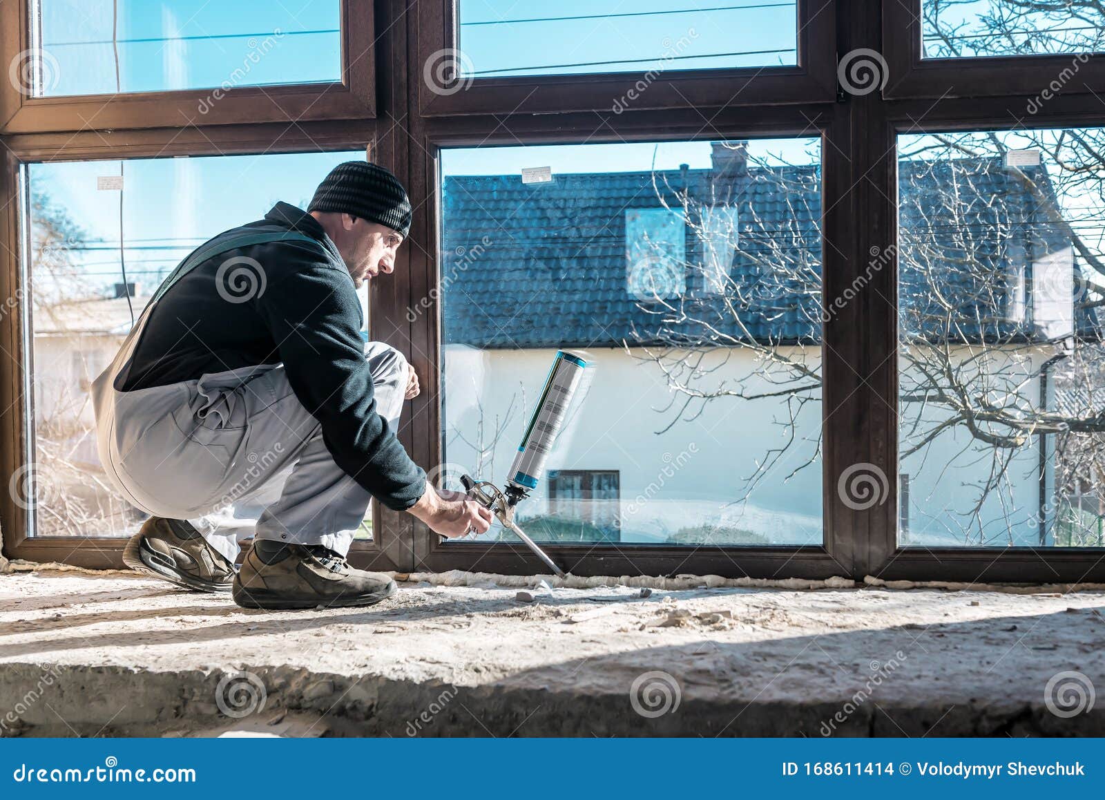 Worker Fix a Window Using Polyurethane Foam Stock Photo - Image of ...