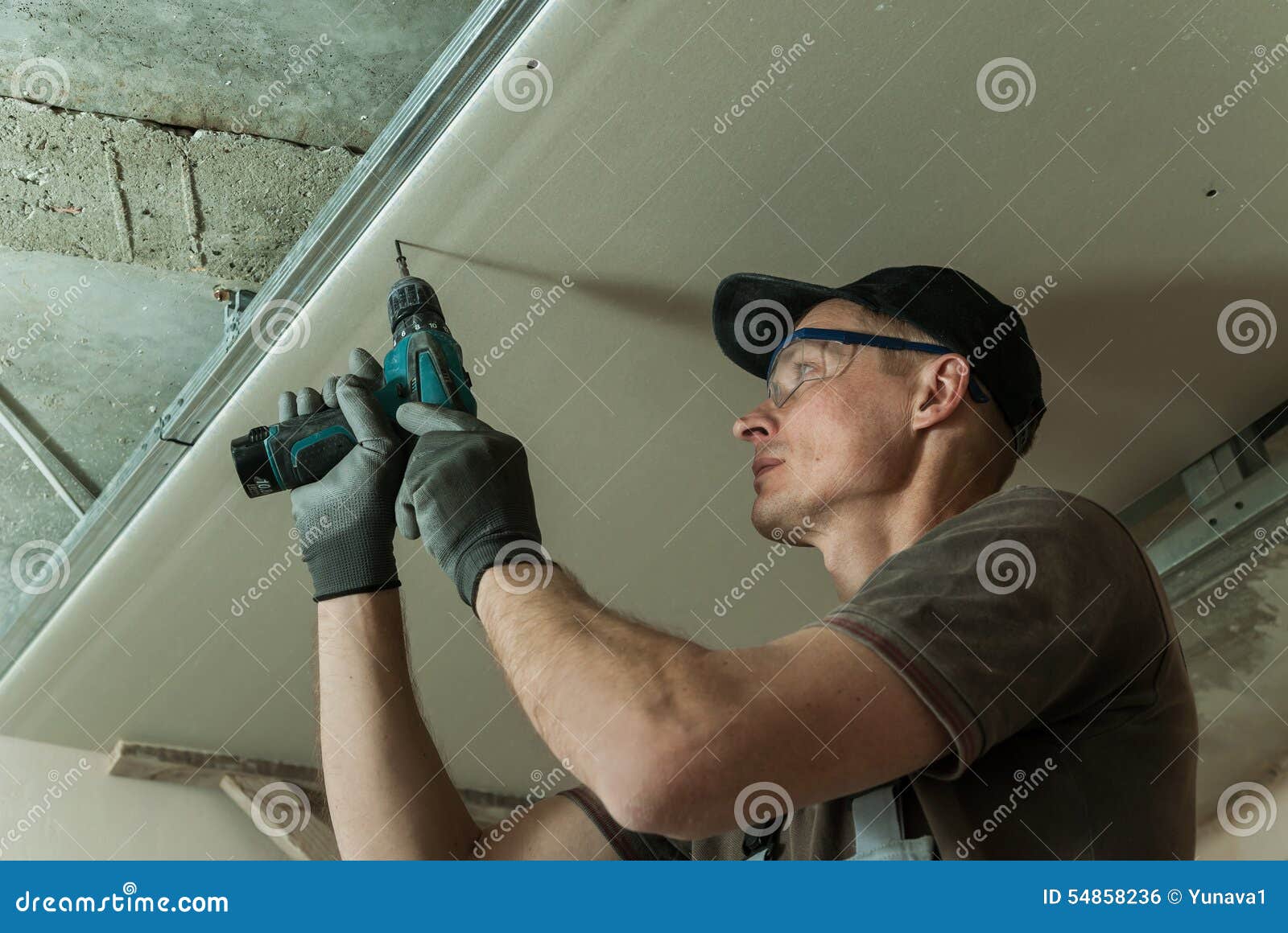 Worker fixes the drywall stock photo. Image of home, installing - 54858236