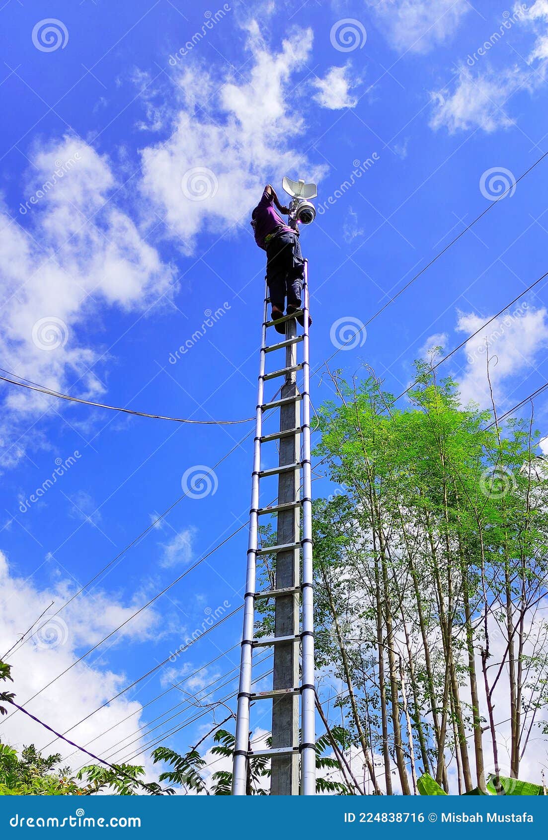 A Worker is Fixing a Broken Cctv and Wireless Network Stock Photo ...