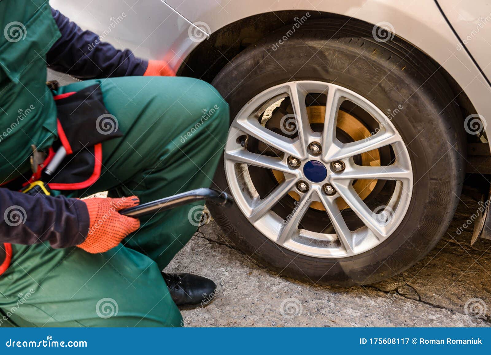 Worker Fixing Car Wheel with Spanner Close Up Stock Image - Image of ...