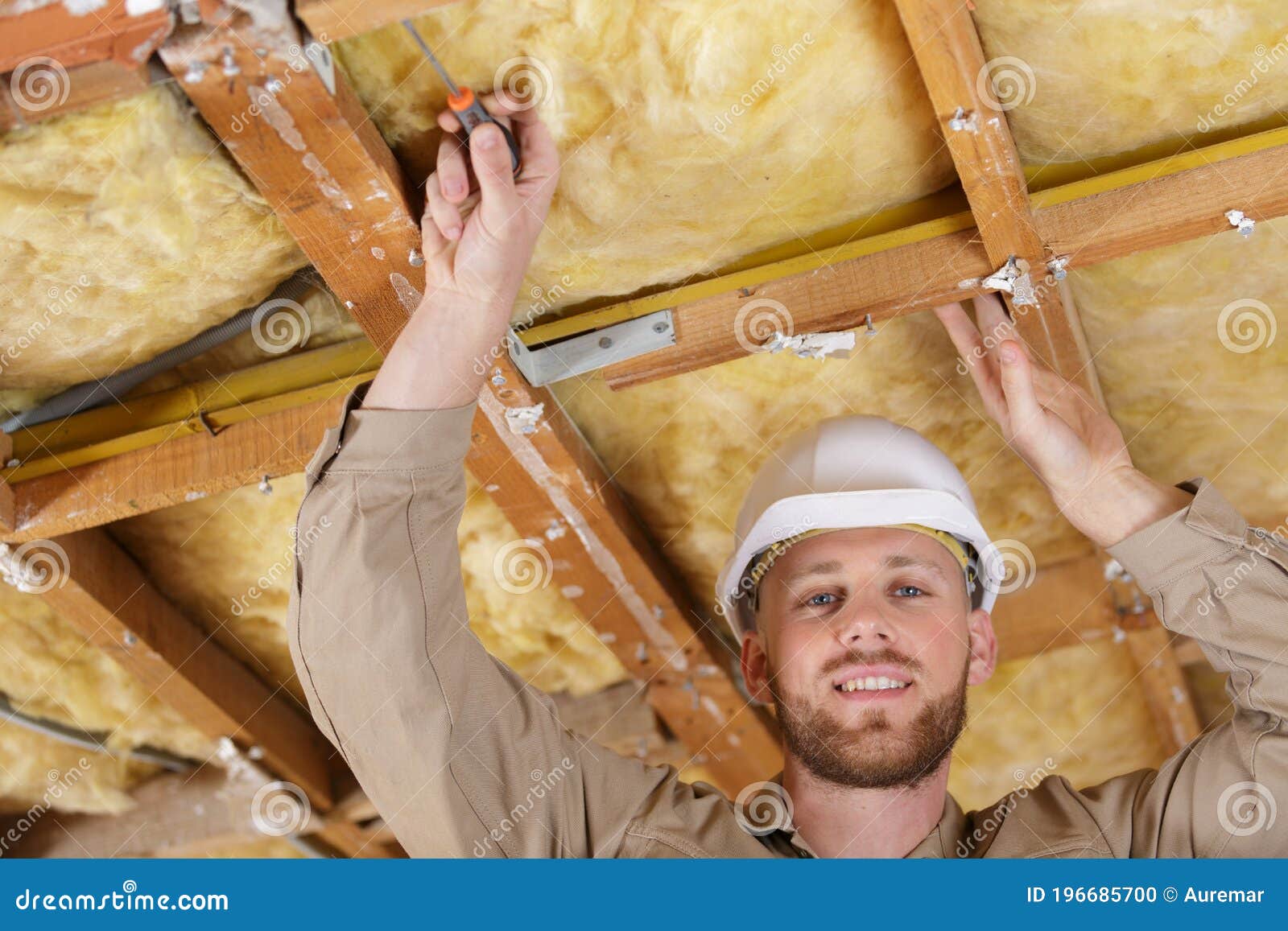 Worker fixing drywall stock photo. Image of improvement - 196685700