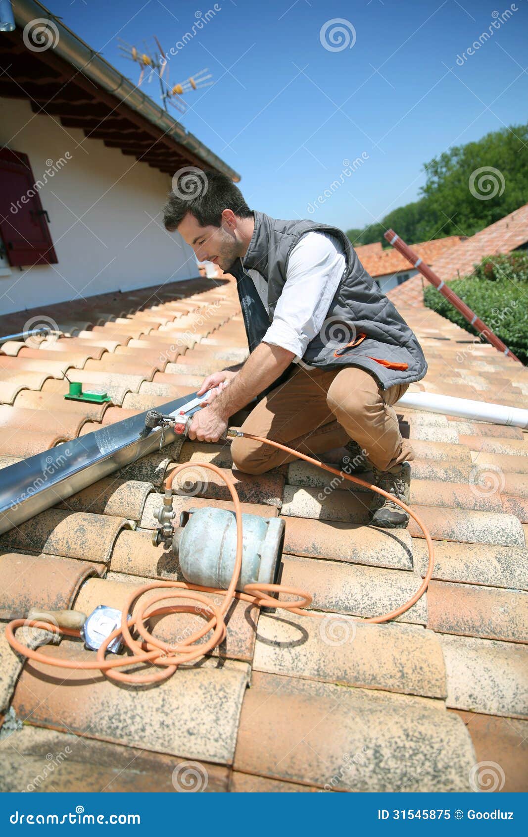 Worker Fixing Gutter on Roof Stock Image - Image of smiling ...
