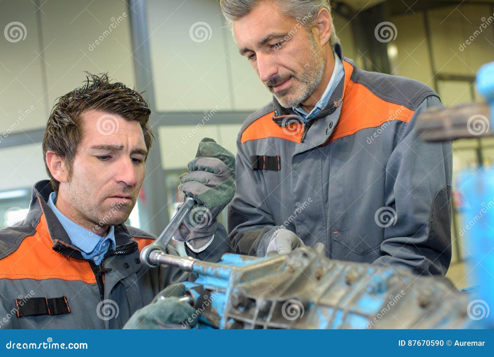 Worker Fixing Heavy Metal Part Stock Photo - Image of manual, machinist ...