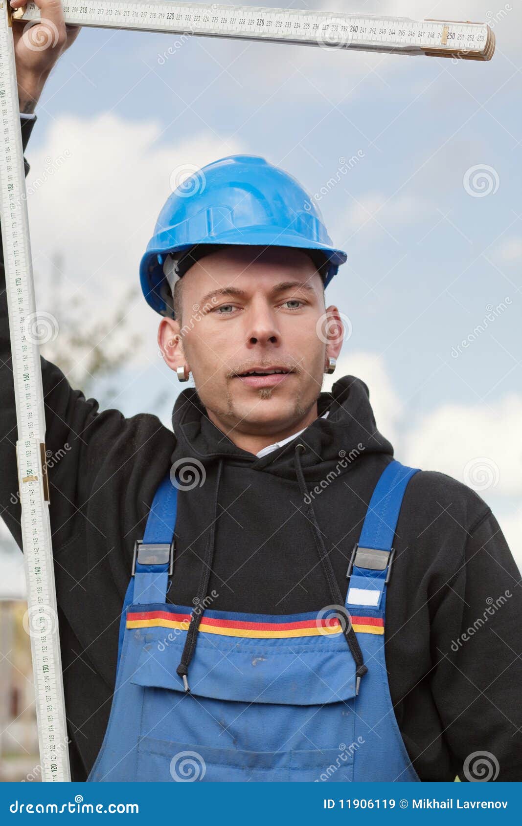 Worker with foldable ruler stock image. Image of workwear - 11906119