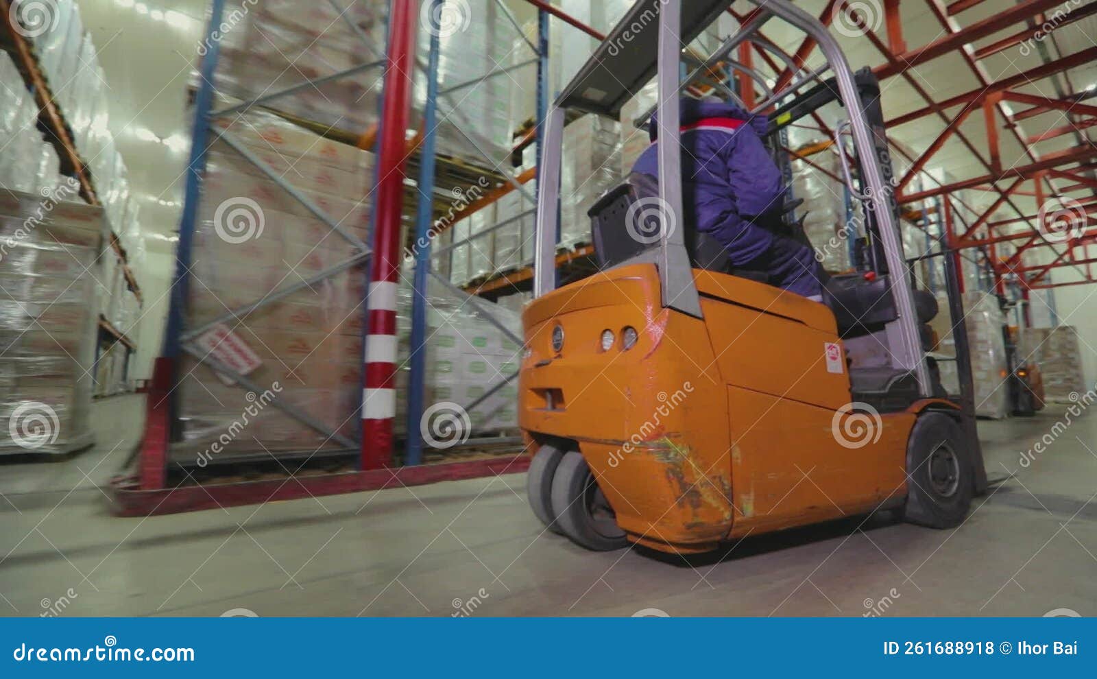 A Worker on a Forklift Will Perform Work in a Warehouse. Large Modern ...