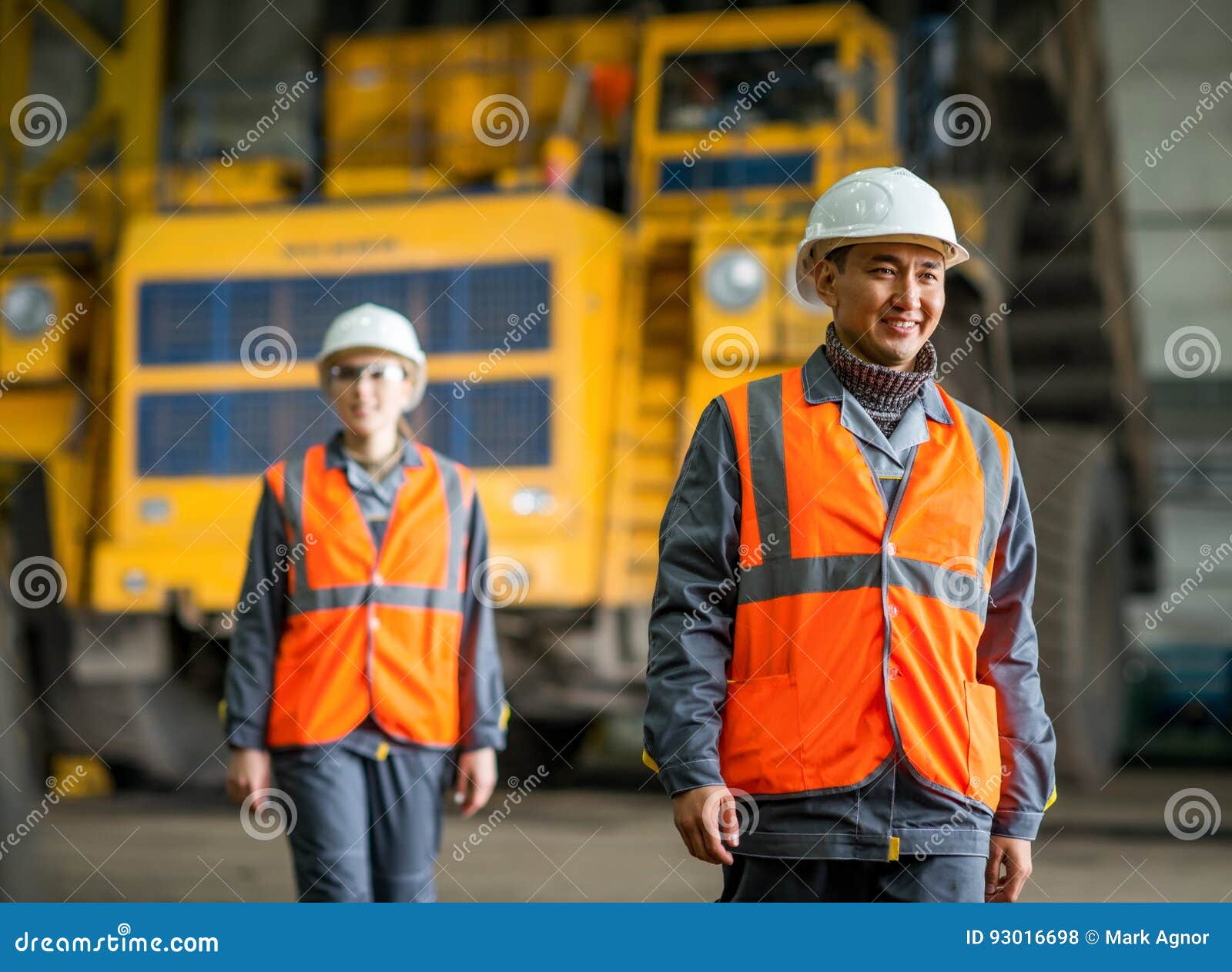Worker in Front of a Bug Truck Stock Photo - Image of geology, industry ...