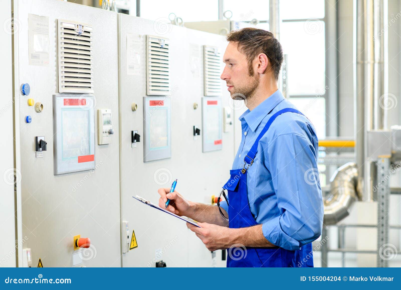 Worker in Front of Control Cabinet Stock Photo - Image of professional ...