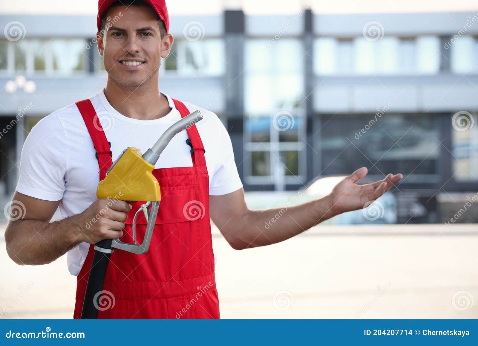 Worker with Fuel Pump Nozzle at Modern Gas Station Stock Photo - Image ...