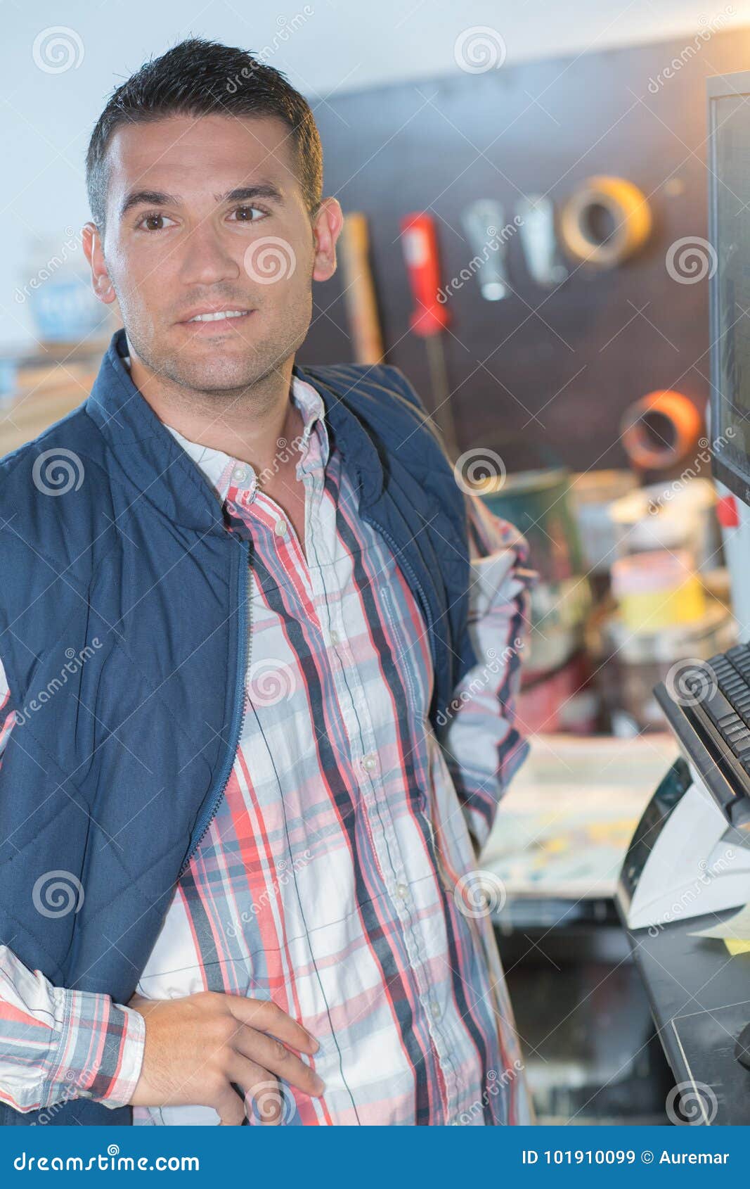 Worker in garage workshop stock image. Image of drill - 101910099