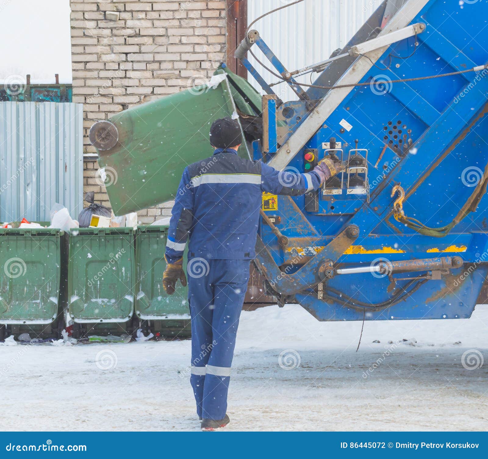 Worker at Garbage Collection, Loading Barrels in a Garbage Can ...