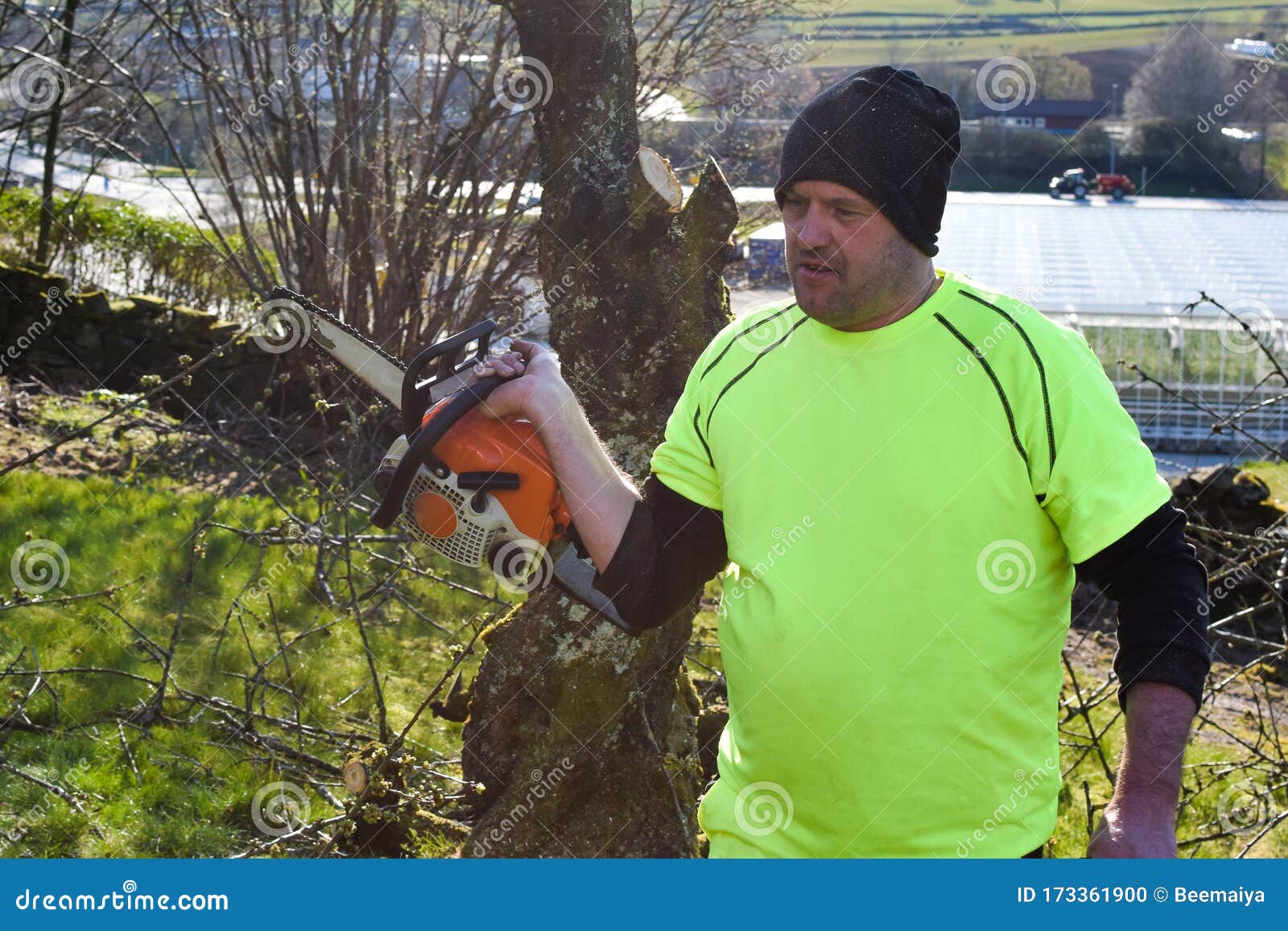 Worker in the Garden with a Chainsaw. Stock Photo - Image of outdoors ...