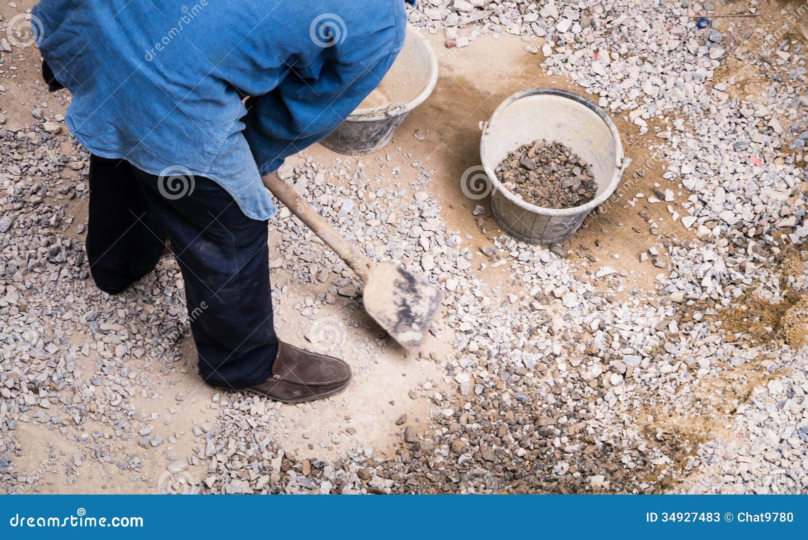 Worker gathering stone stock image. Image of concrete - 34927483