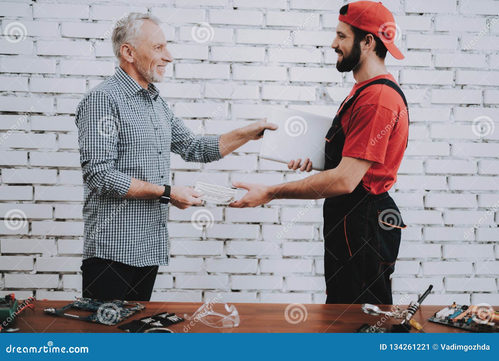 Worker Giving To Man Fixed Laptop in Workshop Stock Image - Image of ...