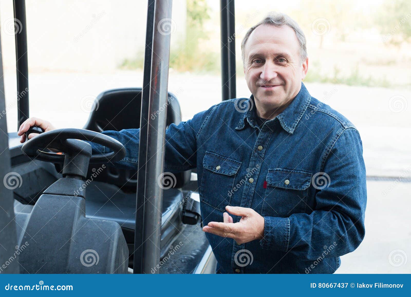 Worker goes driving loader stock image. Image of management - 80667437