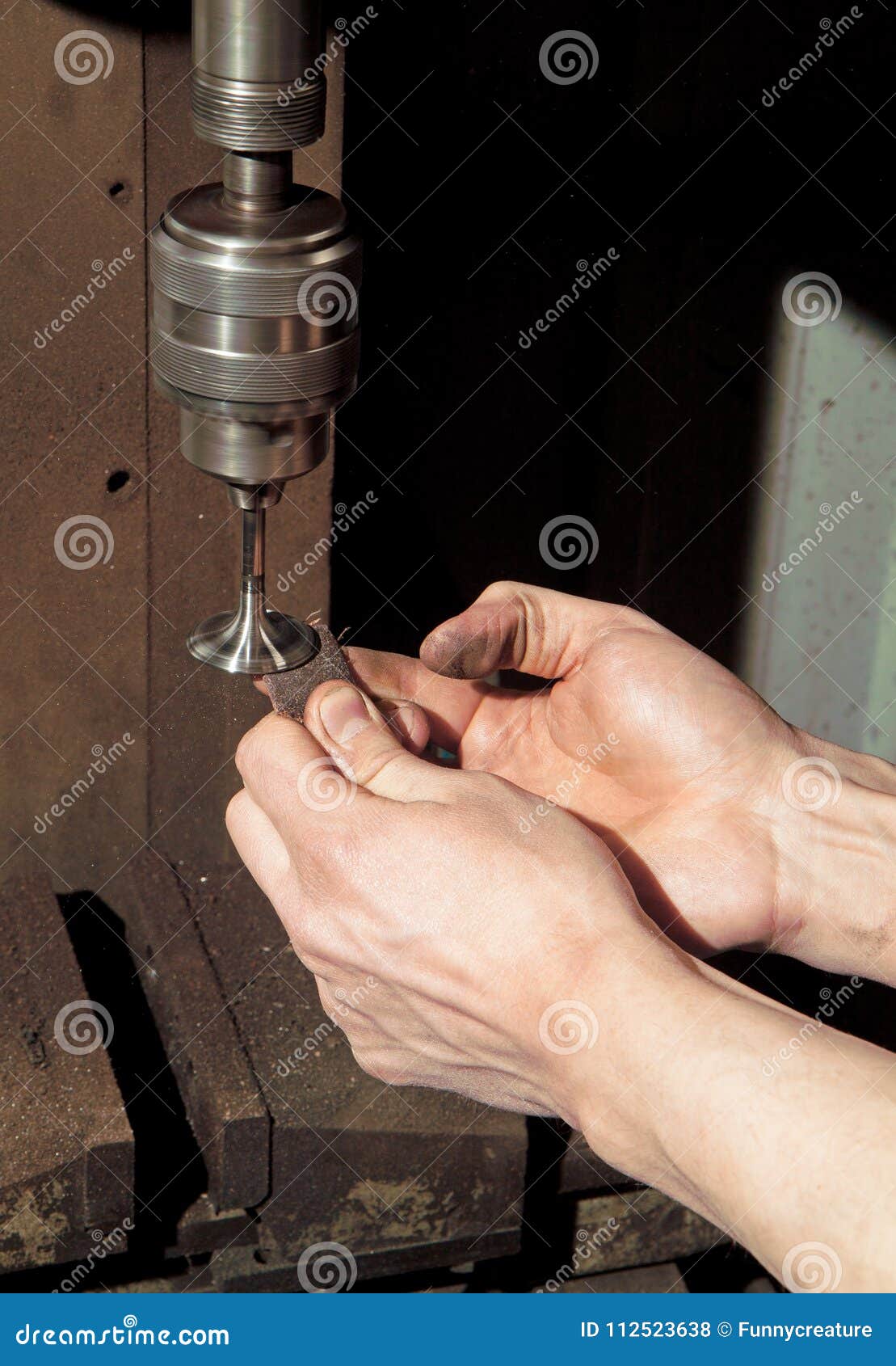 Manual Grinding of an Engine Valve Stock Photo - Image of industry ...