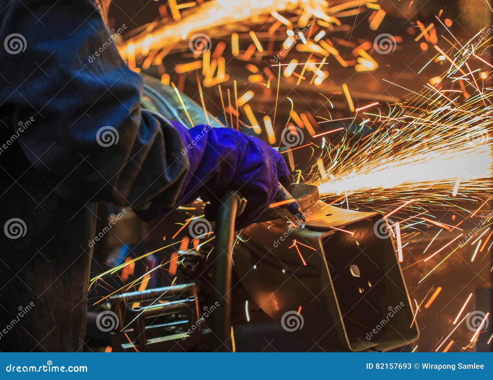 Worker grinding metal stock image. Image of brightly - 82157693