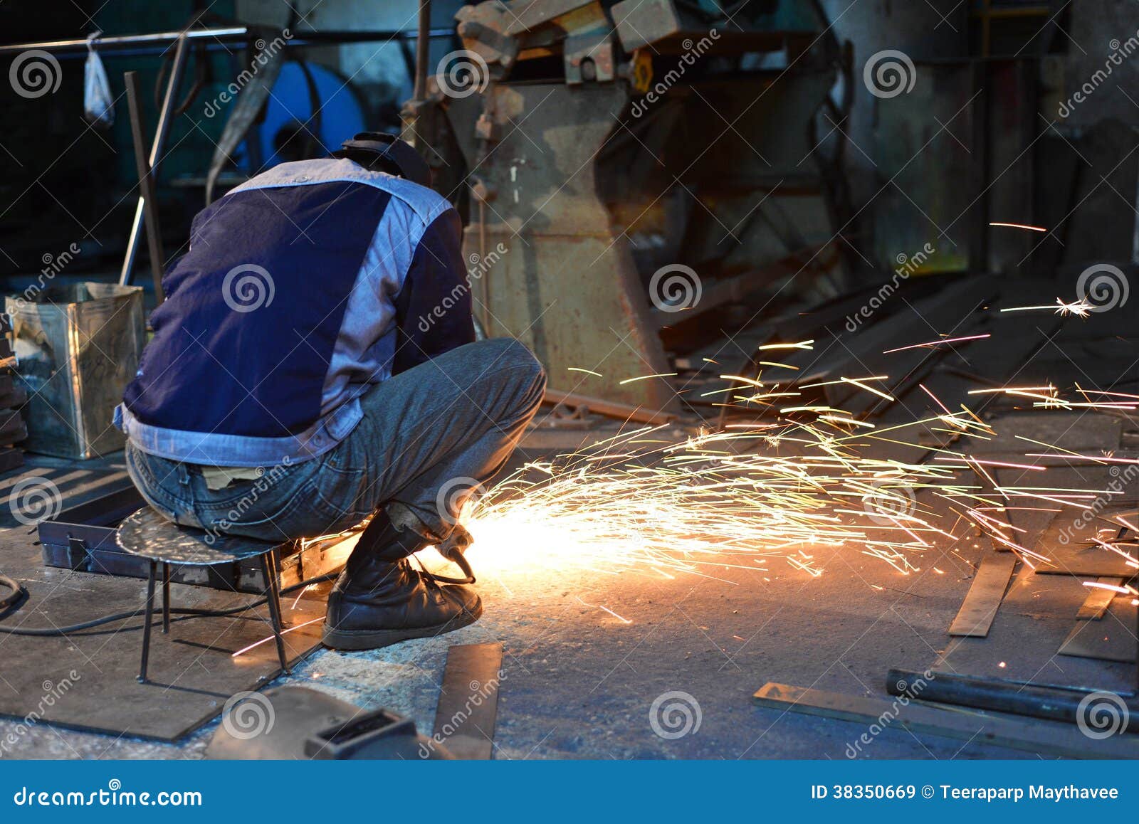 Worker grinding steel stock image. Image of blade, processing - 38350669