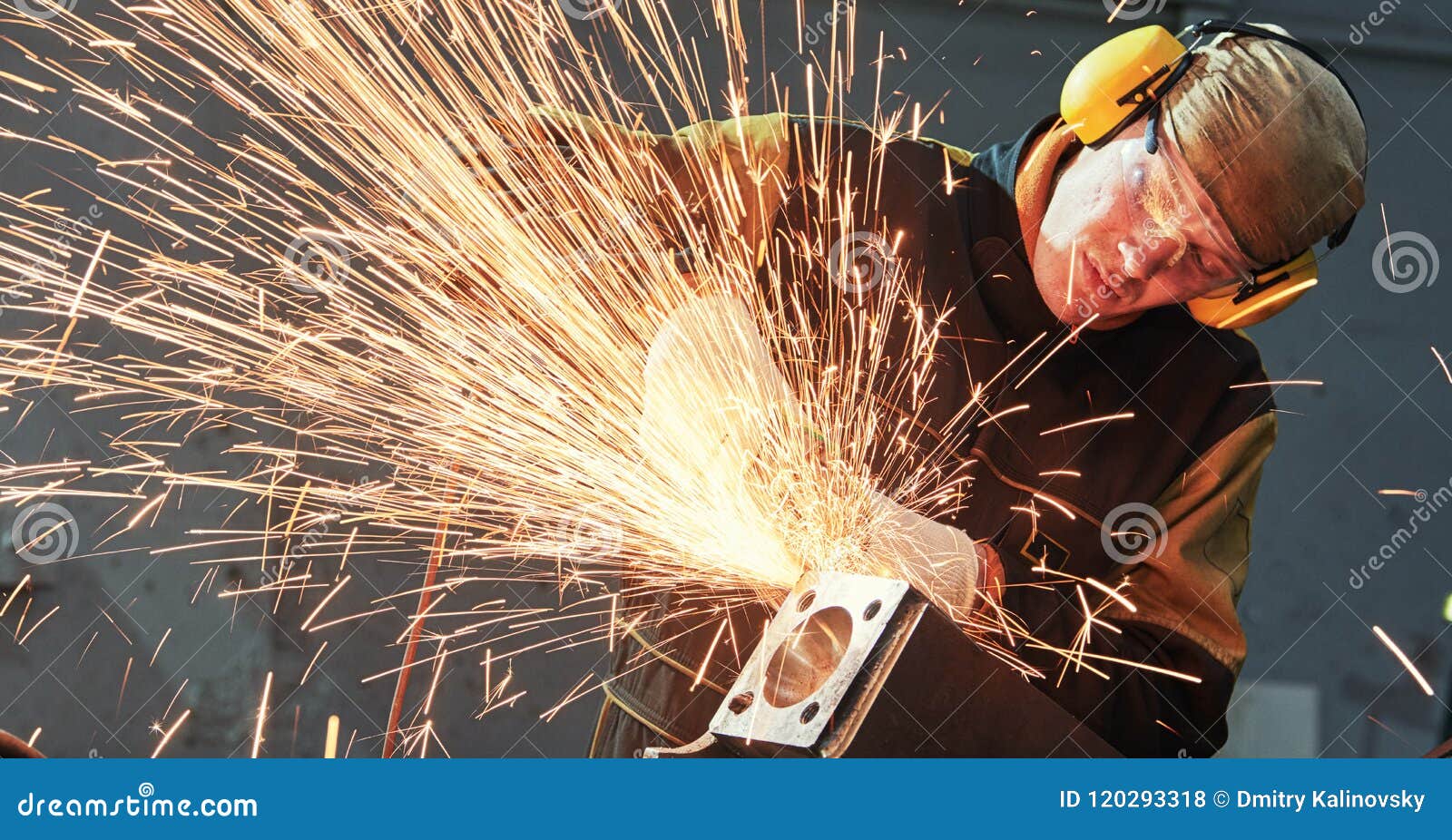 Worker Grinding Weld Seam with Grinder Machine and Sparks Stock Photo ...