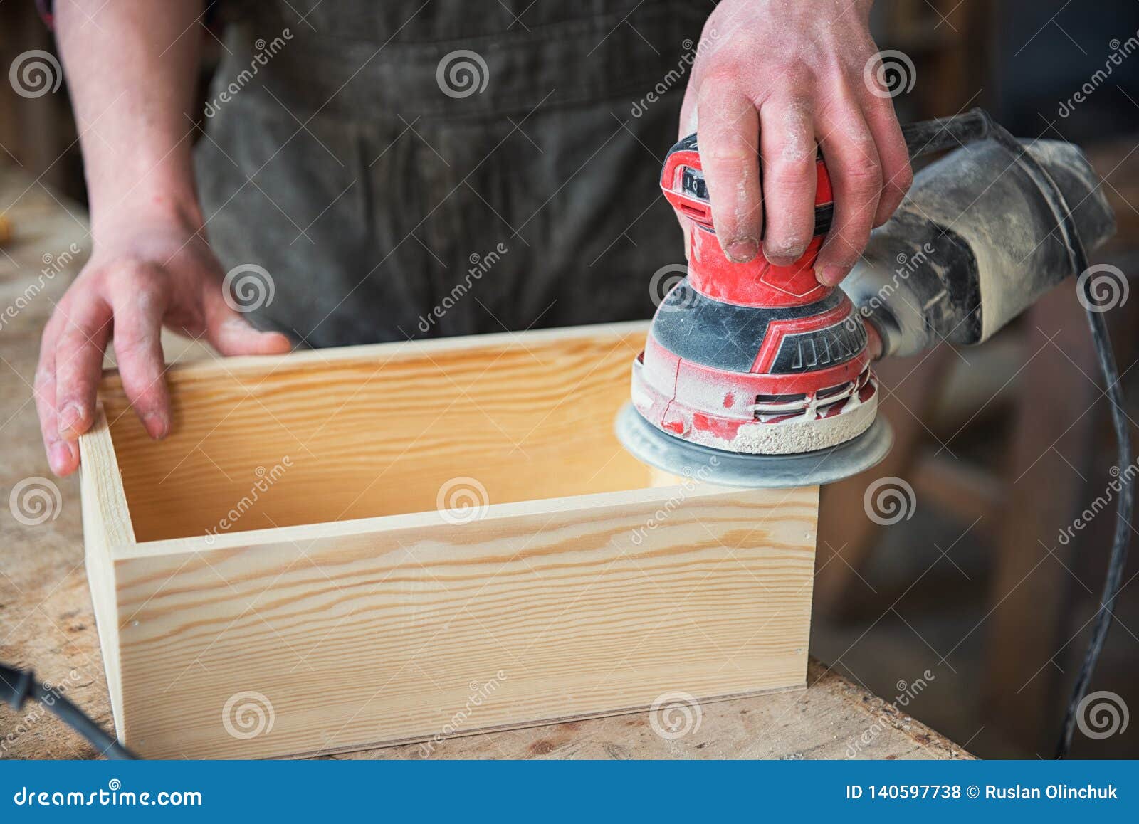 Worker grinds the wood box stock photo. Image of industrial - 140597738