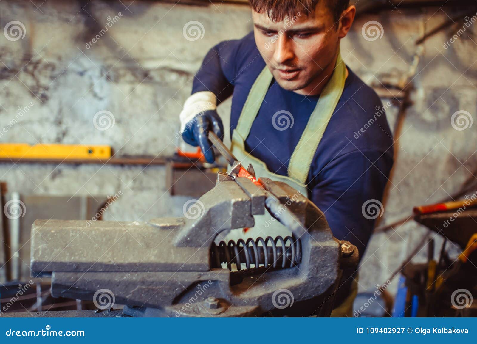 The worker grips the vice stock image. Image of bluecollar - 109402927