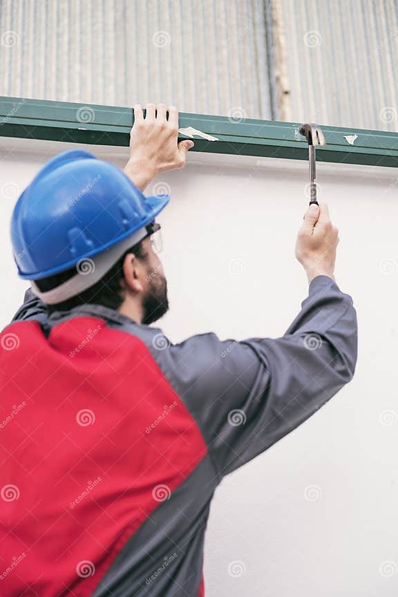 The worker guy hammering stock photo. Image of adult - 103264856