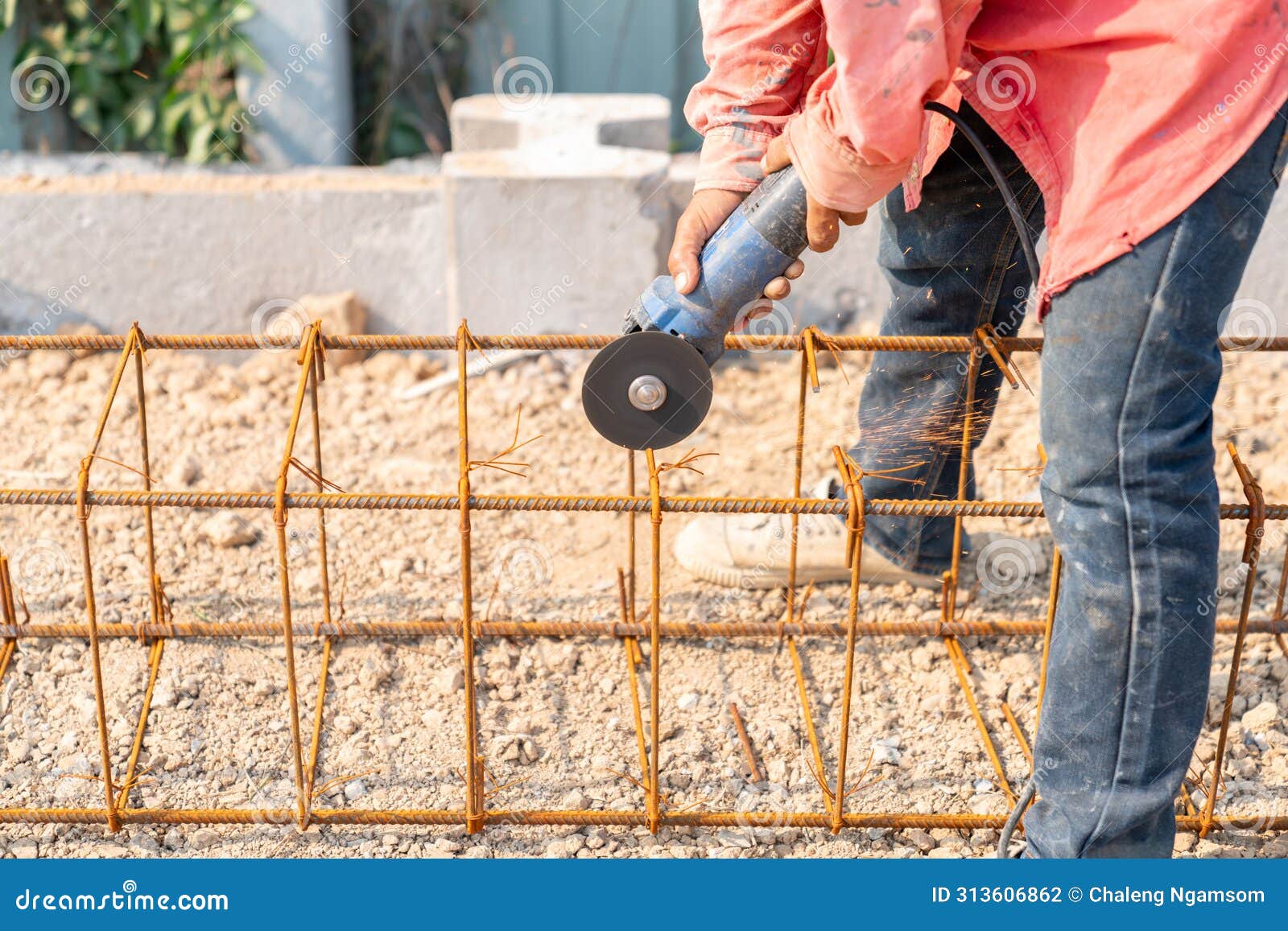 Worker Hand Cuts Off Pieces of Reinforcement Using an Angle Grinder ...