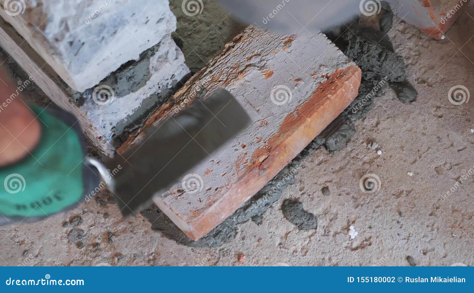 Worker Hand Laying Brick on Cement. Construction of Wall. Bricklaying ...