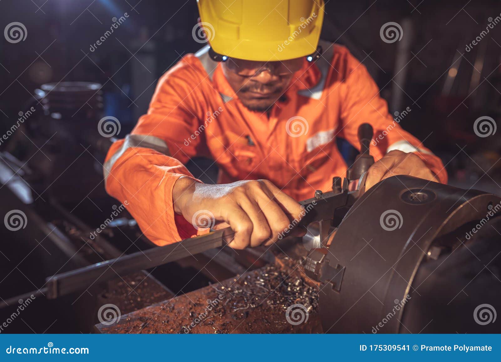 Worker Handles Metal at Lathe Turner Measures the Dimensions of the ...