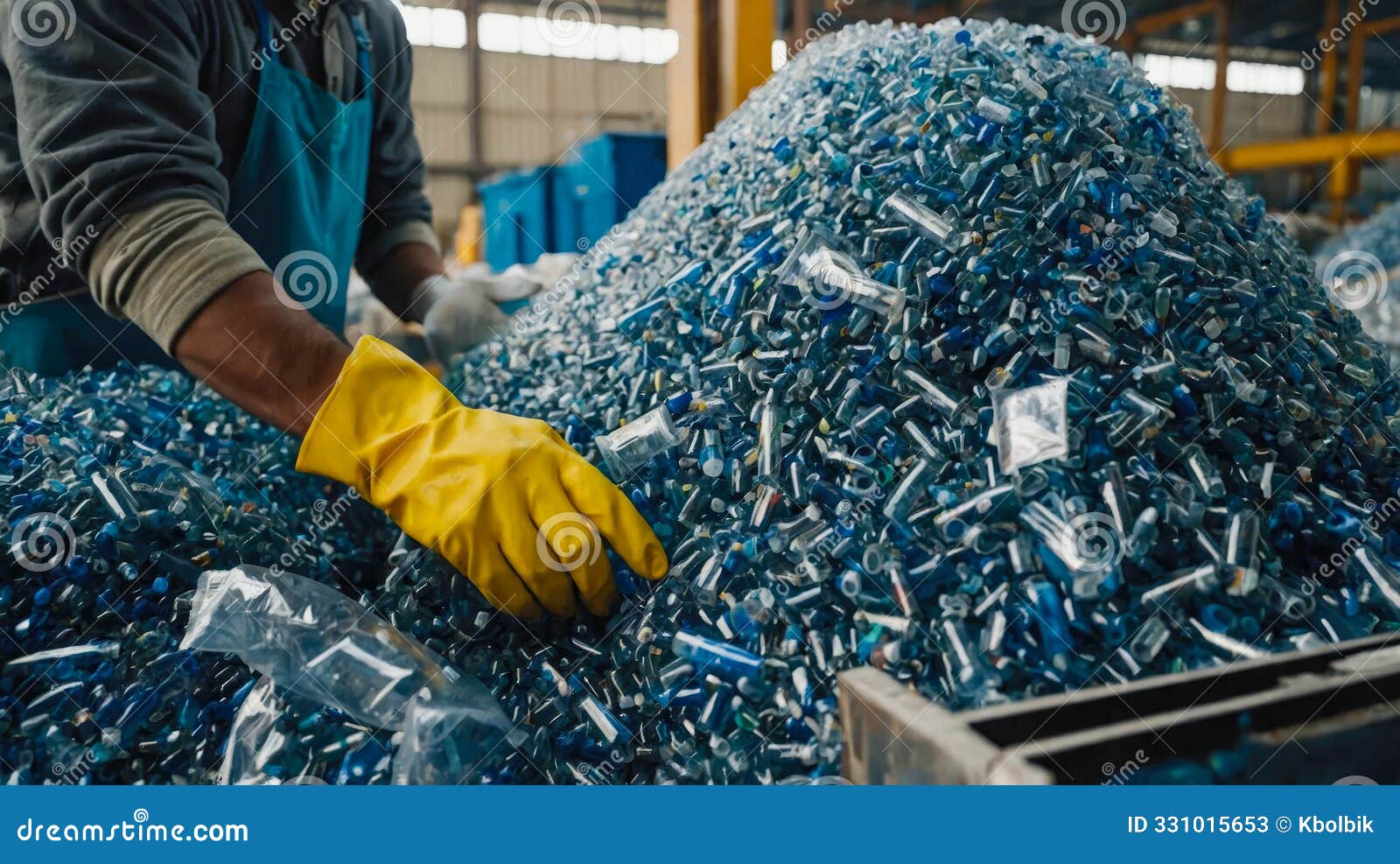 Worker Handling Recycled Plastic in a Factory, Showcasing the Plastic ...