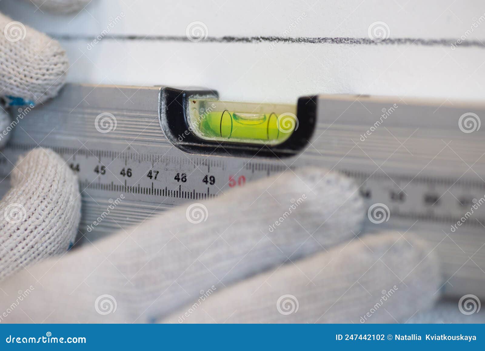 Worker Hands Check the Evenness of the Wall with a Special Tool for ...