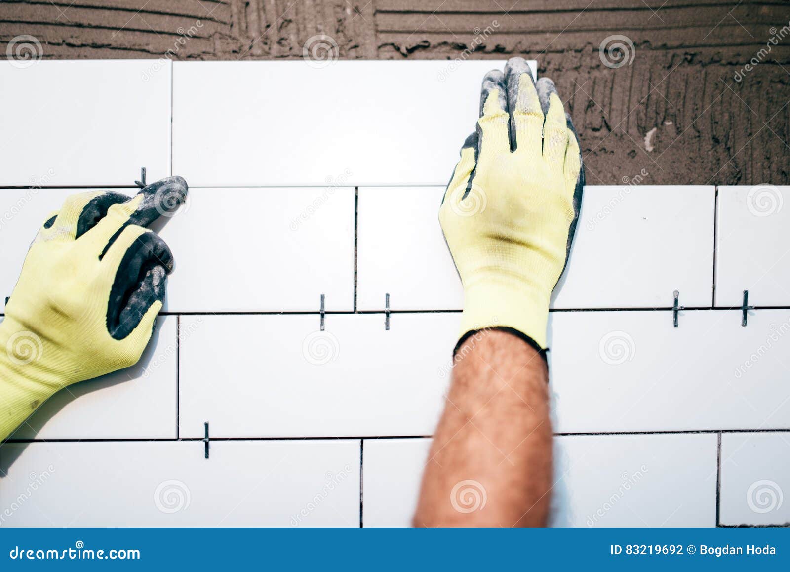 Worker Hands Installing Ceramic Tiles on Interior Walls, Handyman Using ...