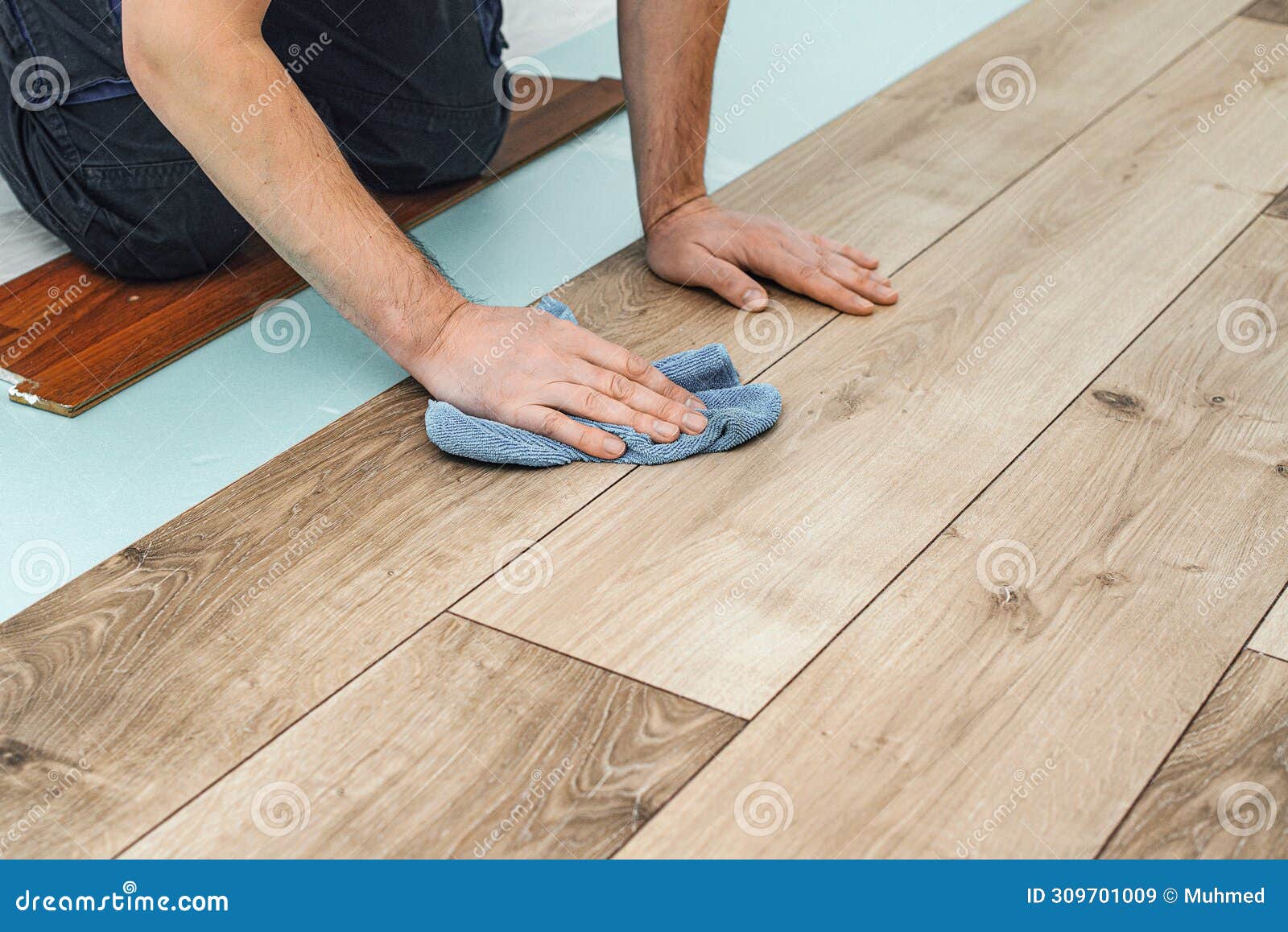 Worker Hands Installing Timber Laminate Floor. Easy and Quick ...