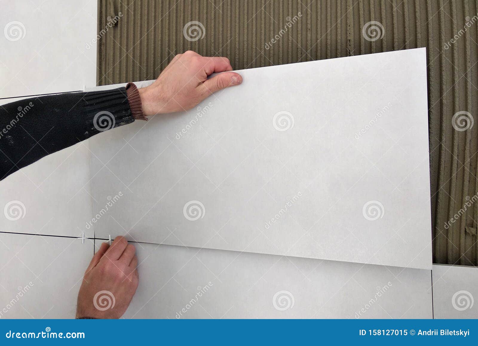 Worker Hands Putting Ceramic Tiles on the Wall Stock Image - Image of ...