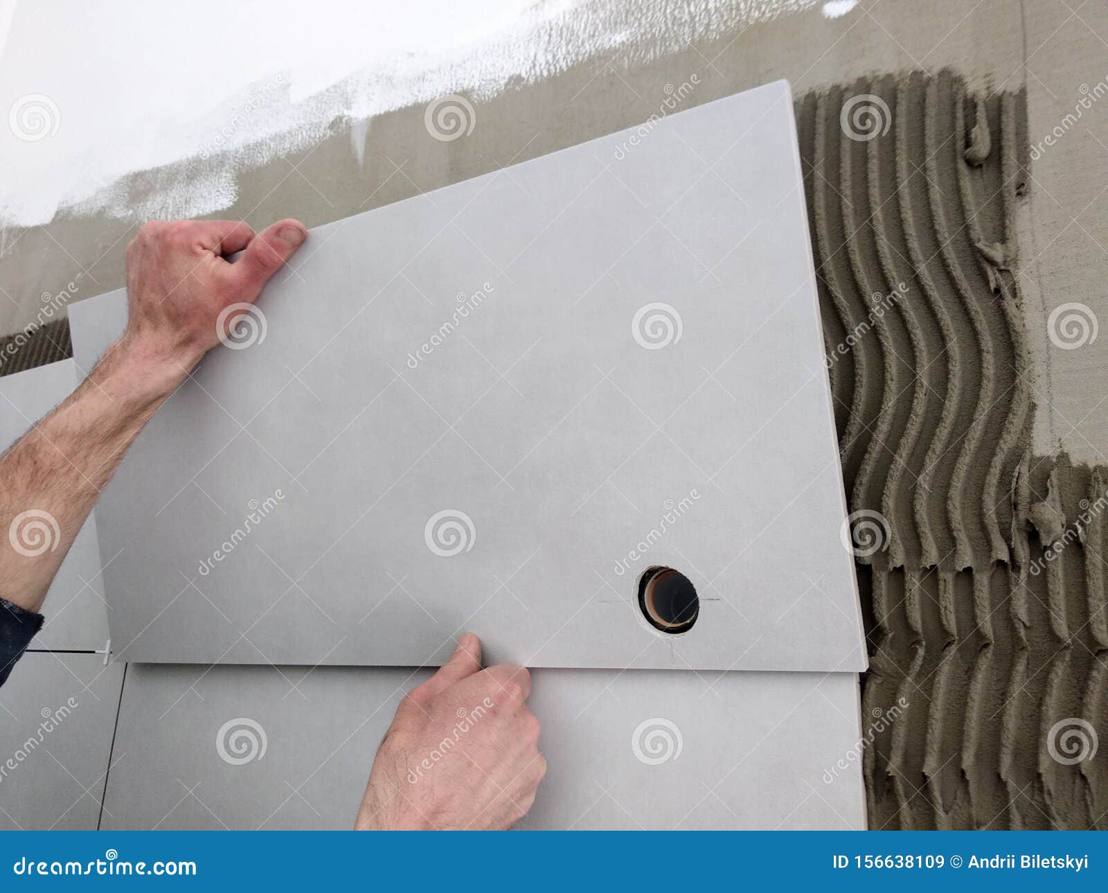 Worker Hands Putting Ceramic Tiles on the Wall Stock Image - Image of ...