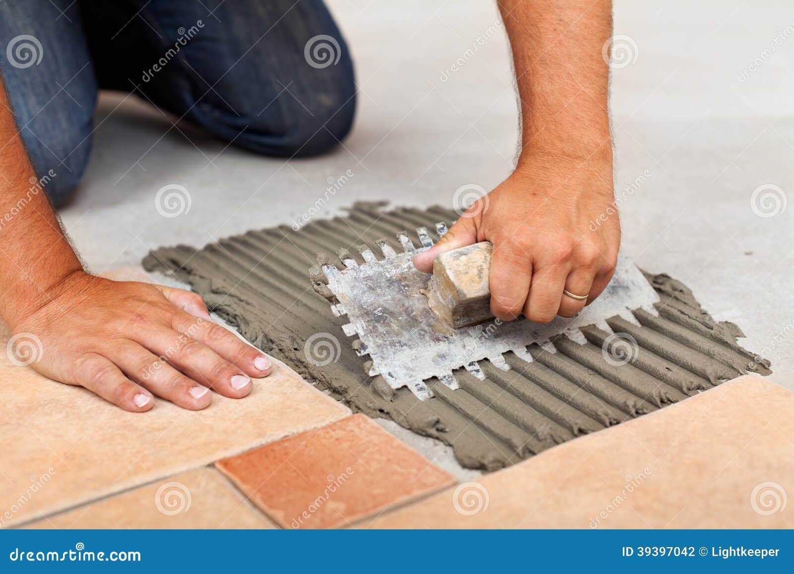 Worker Hands Spreading Adhesive For Ceramic Floor Tiles Royalty-Free ...