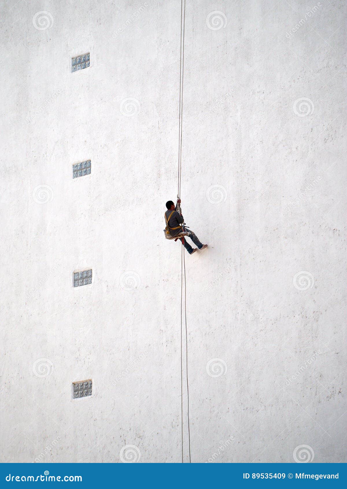 Worker Hanging from Rope on Building Wall Editorial Stock Image - Image ...