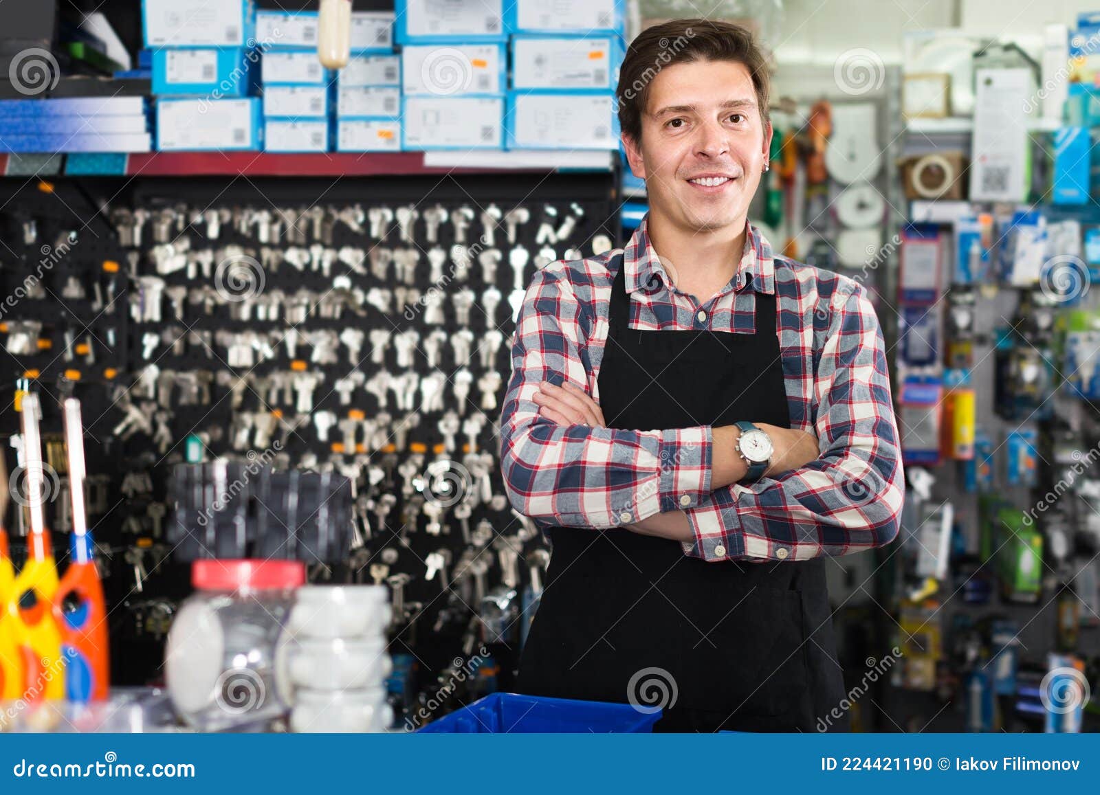 Worker in Hardware Store Trading Goods for Water Tap in Uniform Stock ...