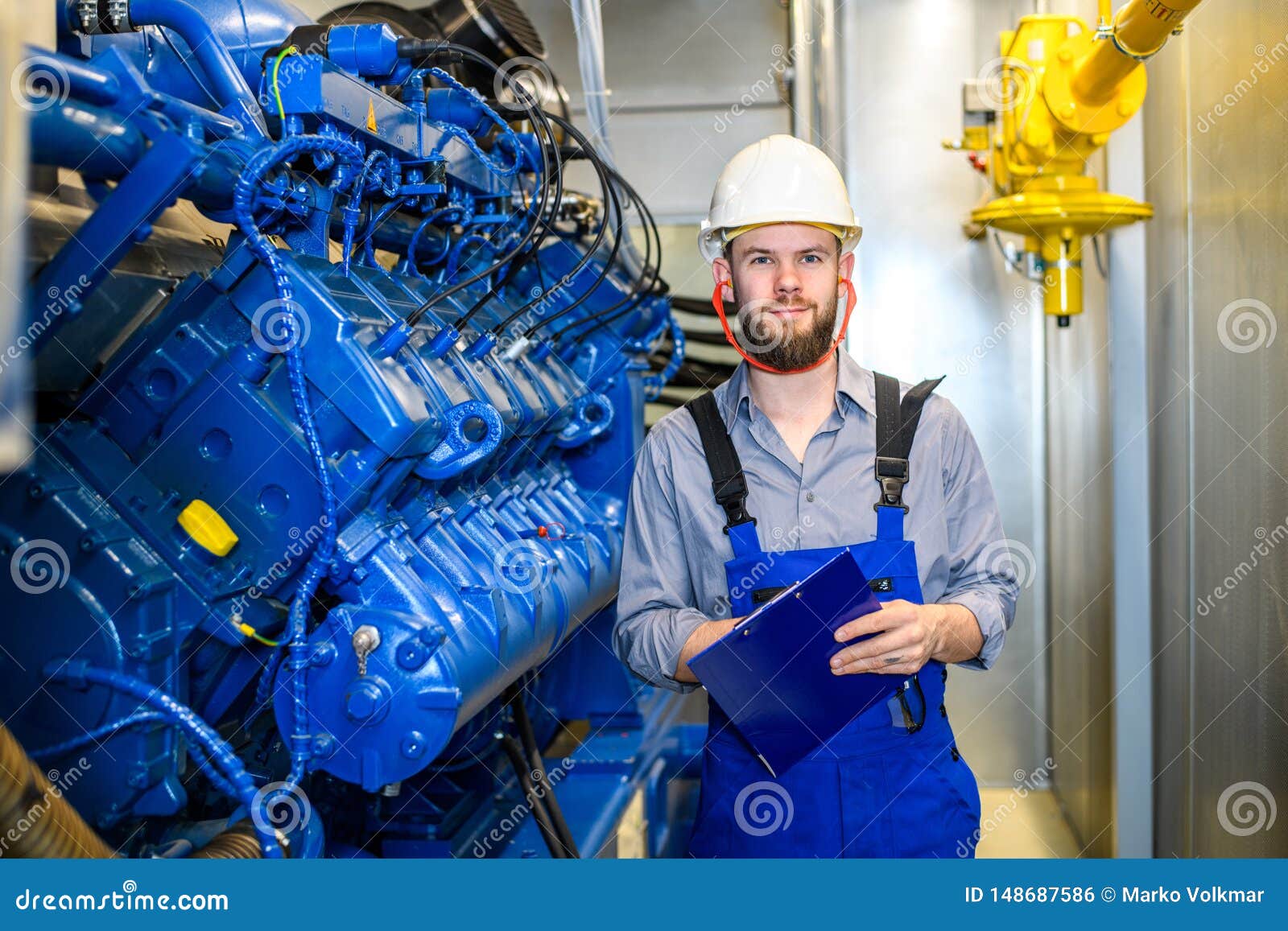 Worker with Helmet Working on Big Generator Stock Photo - Image of pipe ...