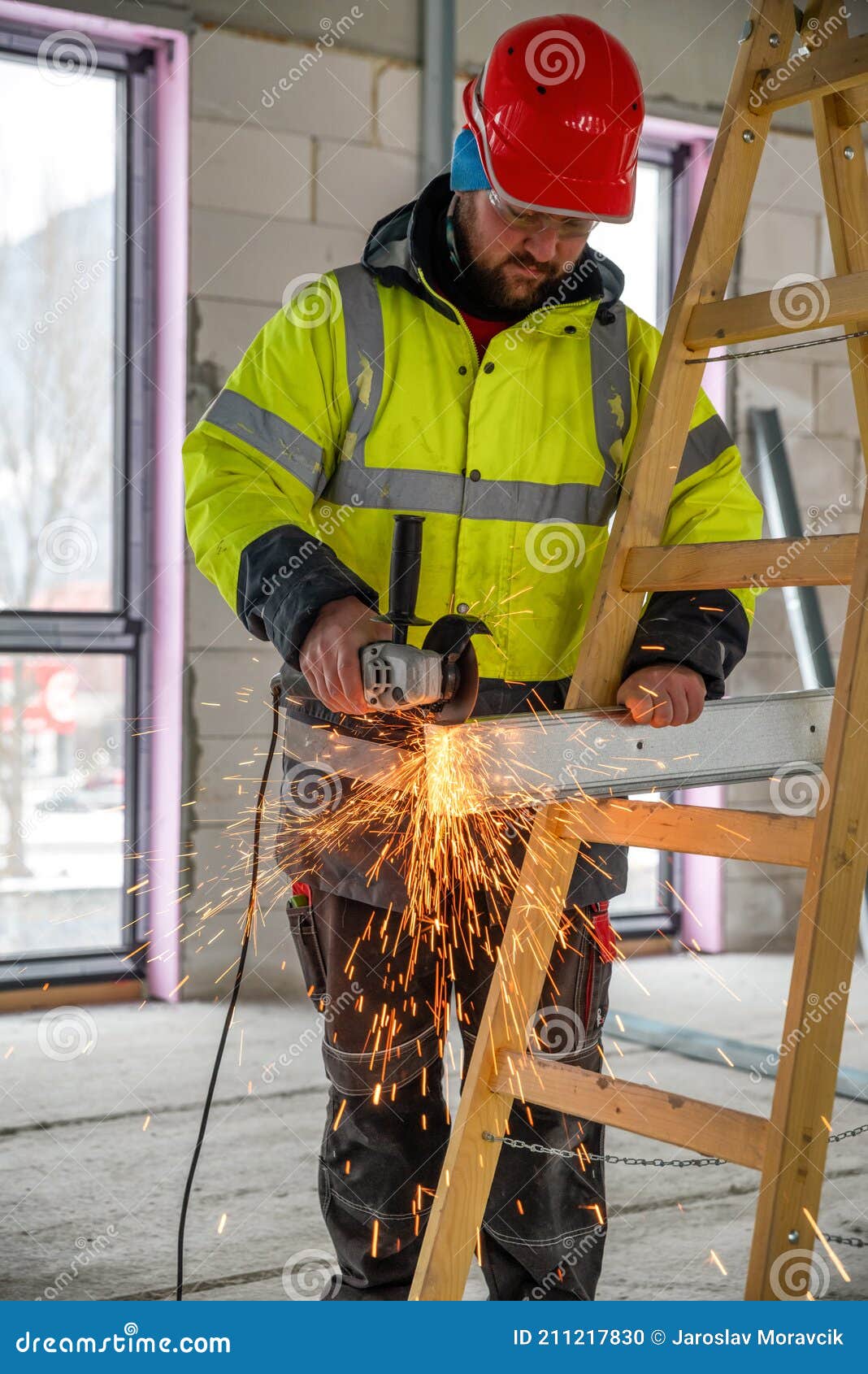 Worker with Helmet Using Grinding Machine Stock Photo - Image of ...