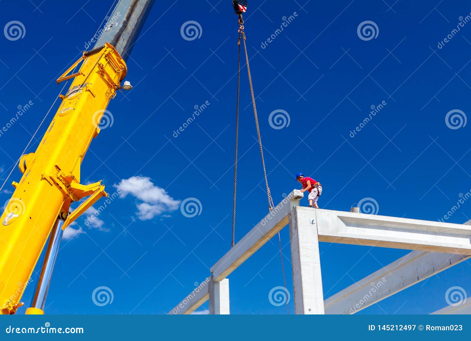 Worker is Helping Crane To Keep Balance and Direction of Concrete Joist ...