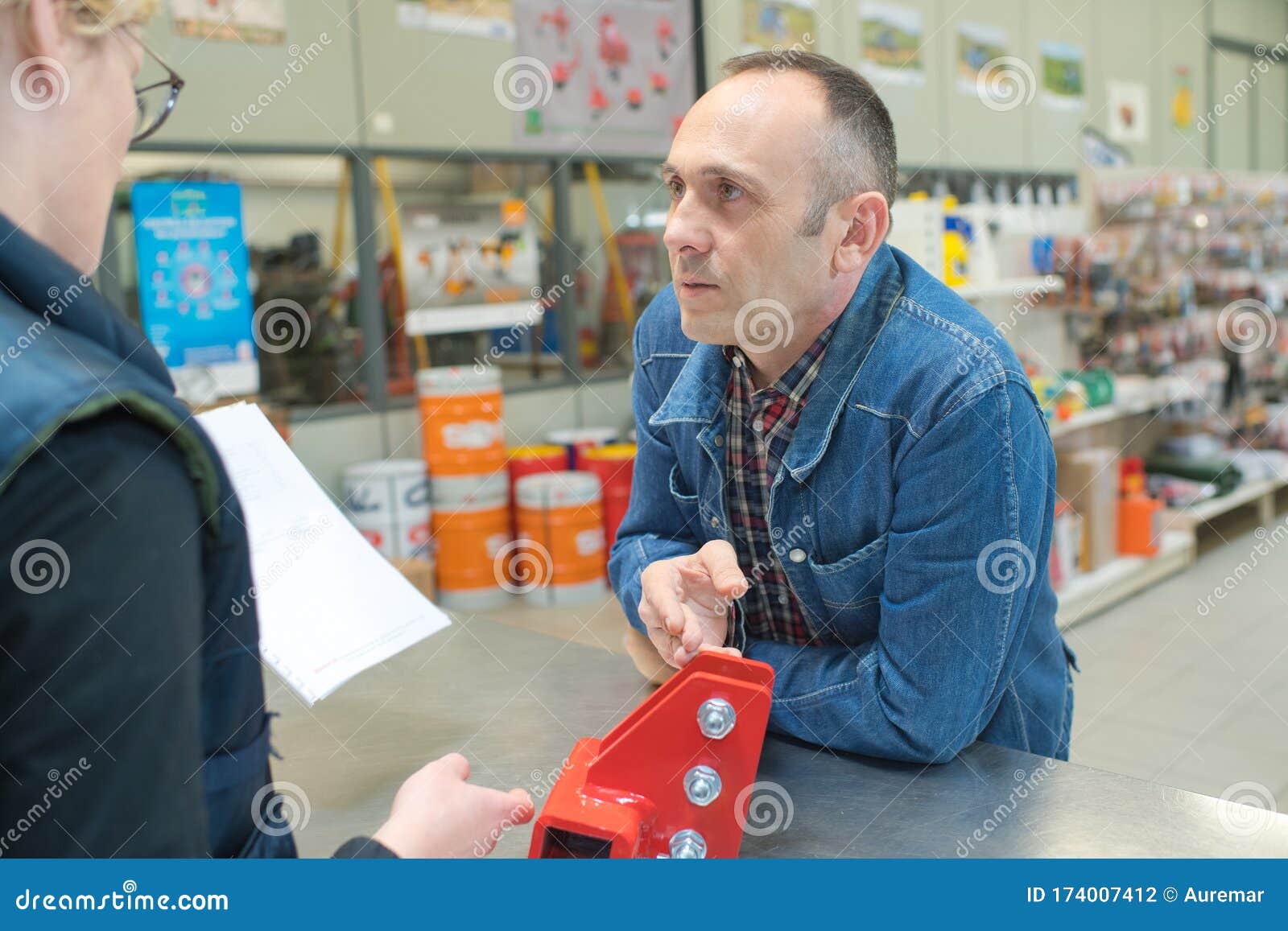 Worker Helping Customer in Hardware Store Stock Photo - Image of ...