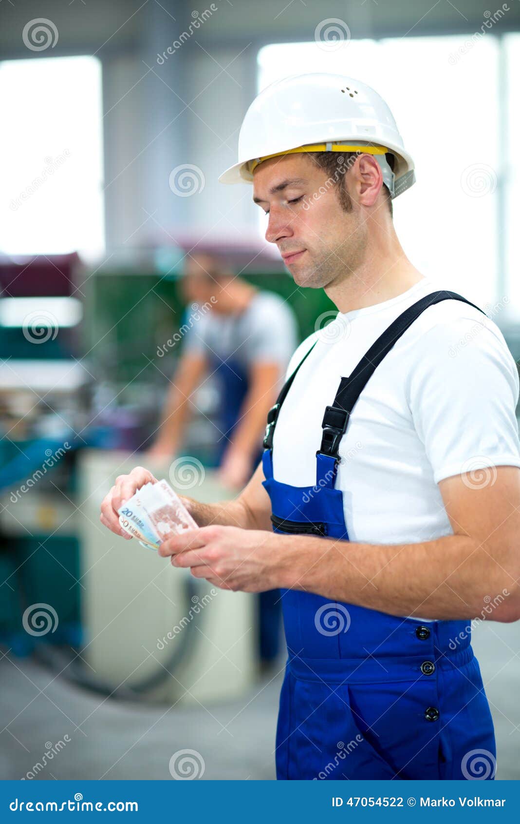 Worker with his wages stock photo. Image of money, mechanic - 47054522