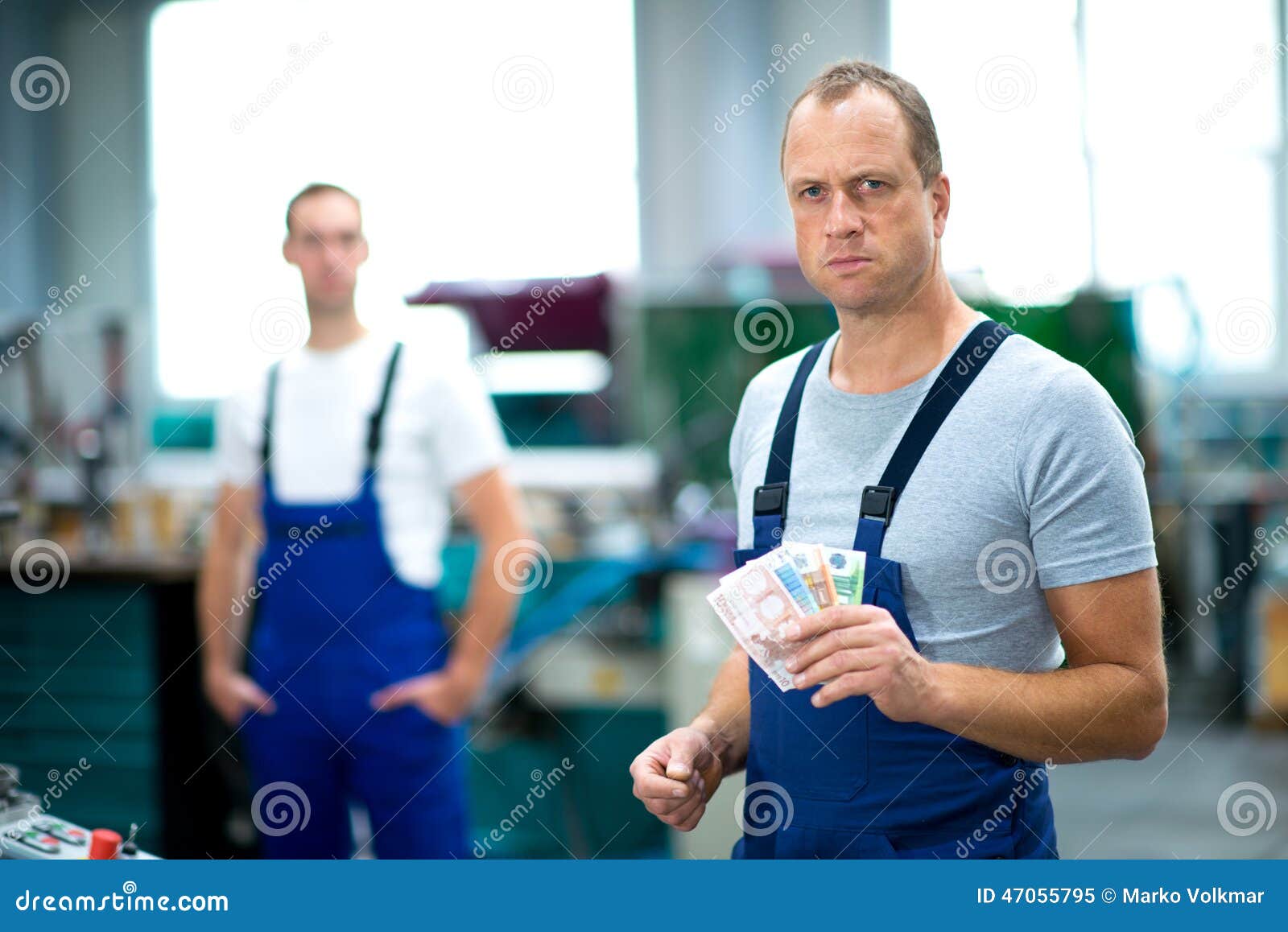 Worker with his wages stock image. Image of bank, mechanic - 47055795