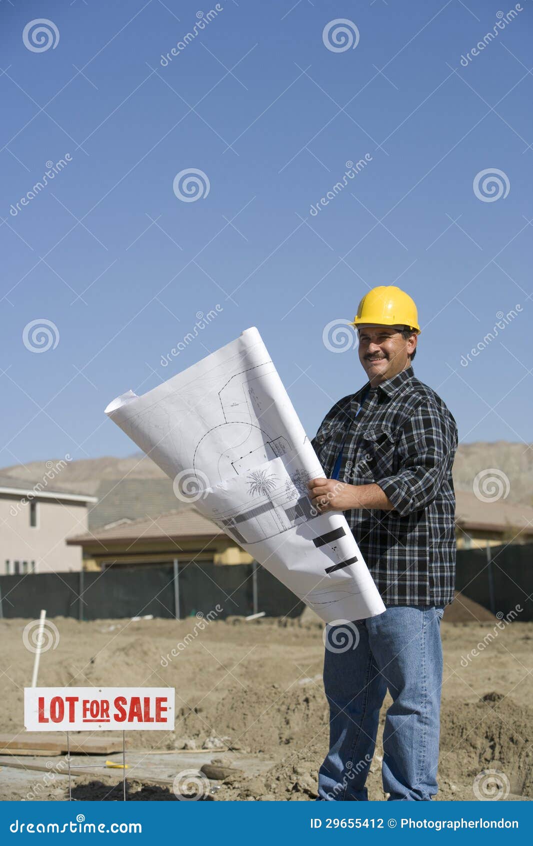 Worker Holding Blueprints stock photo. Image of estate - 29655412