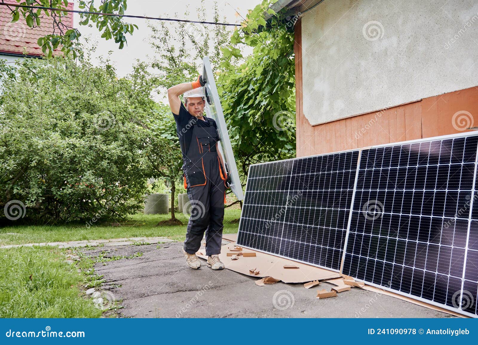 Male Worker Carrying Solar Panel for Installing Stock Photo - Image of ...