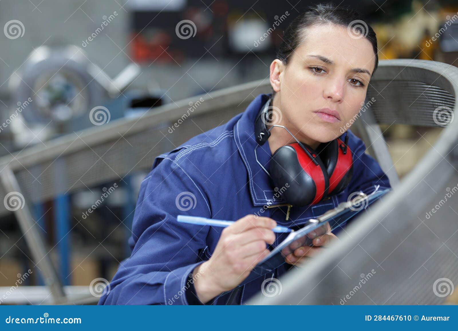 Worker Holding Check List and Writing Notes Working in Warehouse Stock ...